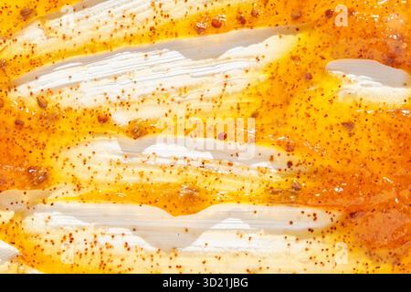 Bright orange jam spread with creamy strokes and seed textures Stock ...
