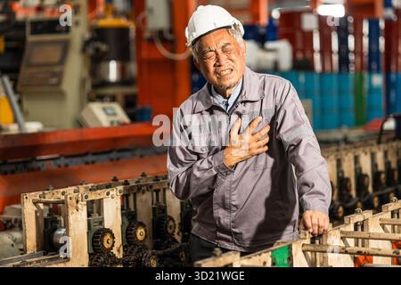 Senior factory worker chest pain suffering from heart attack, heart ...