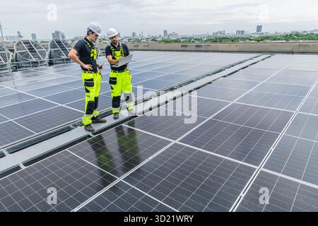 Engineer checking solar panel setup. Using smart app in tablet Stock ...
