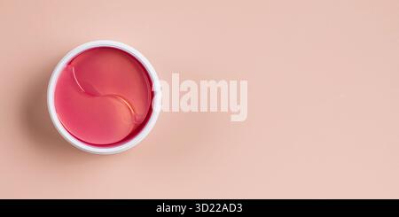 Pink hydrogel eye patches in a box. Banner with cosmetology concept and ...