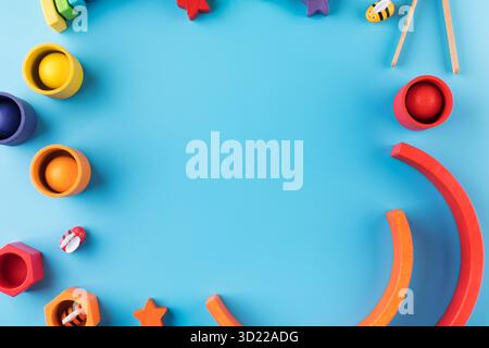 Frame made of educational toys on blue background Stock Photo - Alamy