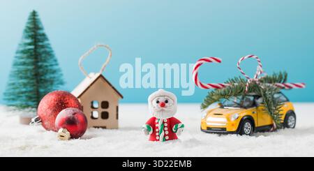 Santa christmas decoration with fake snow Stock Photo - Alamy