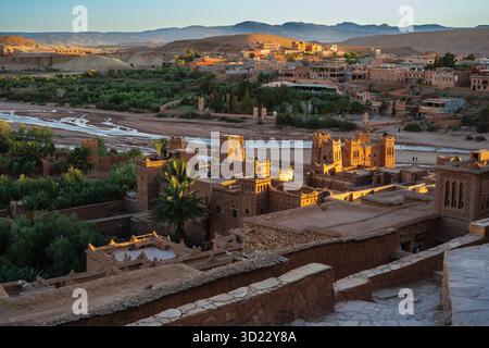 Ancient clay buildings and green landscape in a desert mountain village ...