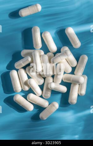 vitamins in capsules on a white background Stock Photo - Alamy
