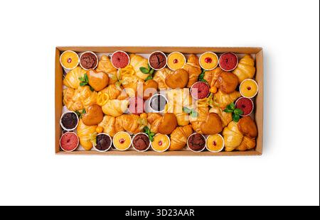 Assorted pastries and desserts displayed in a decorative box for ...