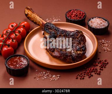 Grilled bone-in meat, beef tomahawk steak, juicy barbecued meat ...