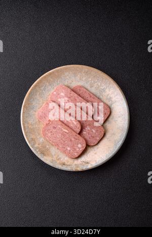 Spiced ham slices, canned meat for lunch sandwiches. Spiced ham as a ...