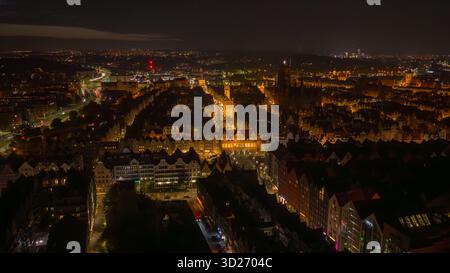 A nighttime aerial view shows the downtown Los Angeles skyline beneath ...