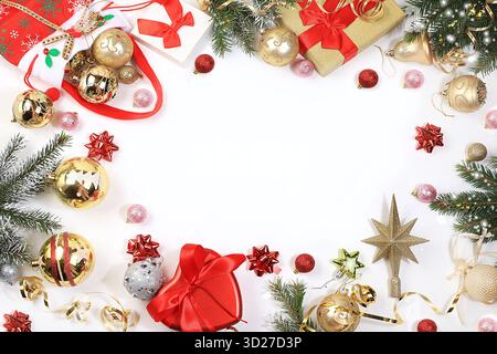 Frame made of beautiful Christmas decorations and fir branches on pink ...