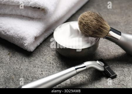 Different barber's tools on grey wooden table, closeup Stock Photo - Alamy