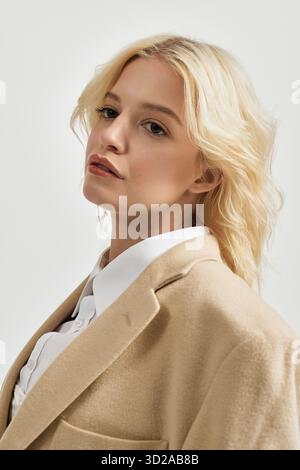 Bright and confident, a blonde woman models denim fashion while ...