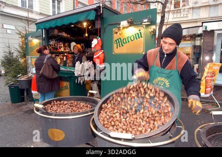 a roasted chestnut sign in german Maroni in front of a sales stand ...