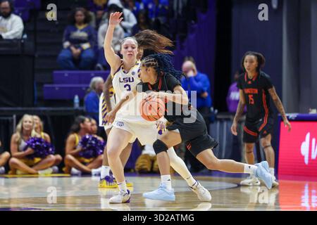 LSU Tigers guard Bella Hines (3), left, and assistant strength coach ...