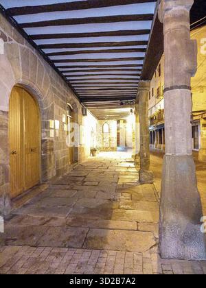 Traditional portico with stone floor and wooden ceiling in old village ...