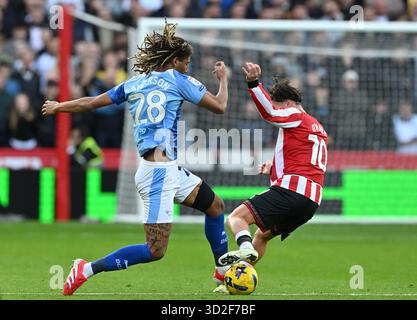 Derby County's Dion Sanderson (left) celebrates scoring their side's ...