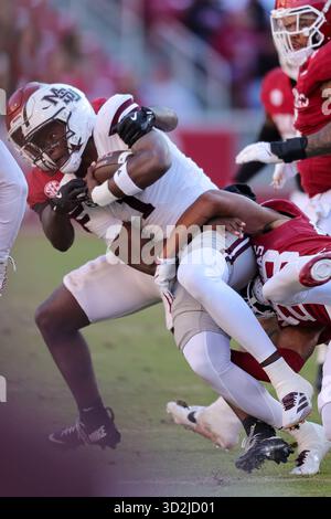 Mississippi State quarterback Kamario Taylor (1) tries to avoid the ...