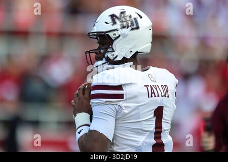 Mississippi State quarterback Kamario Taylor (1) tries to avoid the ...