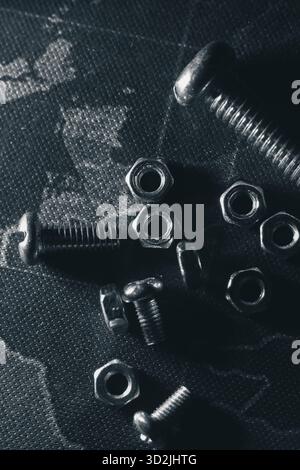 Bolts and nuts on a dark surface Stock Photo - Alamy