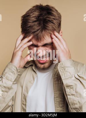 Man feeling migraine head strain. Tired bored man has headache ...