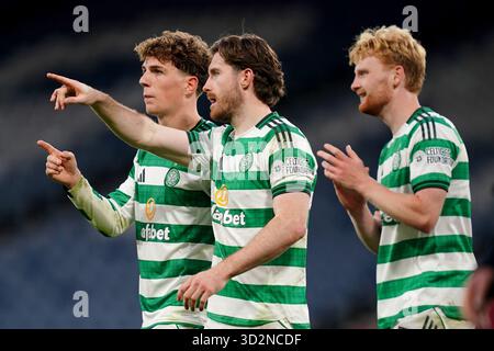 Celtic's Arne Engels (centre left) appears dejected with team-mate Luke ...