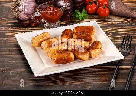 Roasted chicken mini sausages for breakfast in the bowl Stock Photo - Alamy