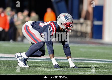 New England Patriots linebacker K'Lavon Chaisson, left, works against ...