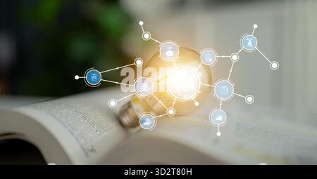 Open book with business icons above Stock Photo - Alamy