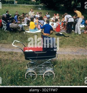 In the 1970s. A baby carriage in a typical design, function and color ...
