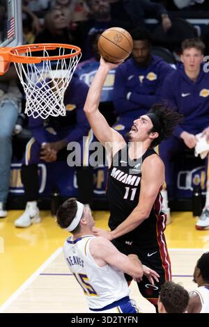 Miami Heat's Jaime Jaquez Jr., left, shoots the ball against ...
