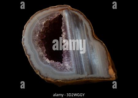 geode cut in half with red, fuchsia and purple agate Stock Photo - Alamy