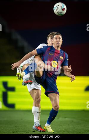 Robert Lewandowski of FC Barcelona and David Costas of Real Oviedo ...