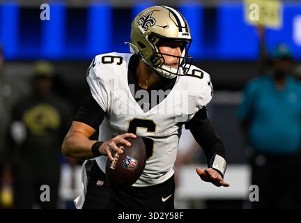 New Orleans Saints quarterback Tyler Shough (6) throws next to ...