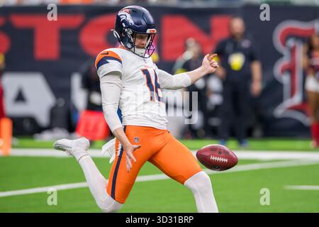 Denver Broncos punter Jeremy Crawshaw (16) in the first half of an NFL ...
