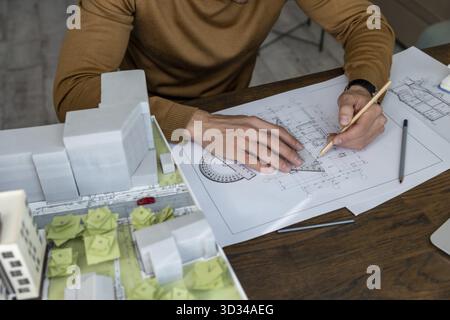 Architectural project workplace. Engineer sketching construction ...
