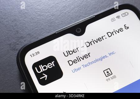 In this photo illustration a Uber logo seen displayed on a smartphone ...