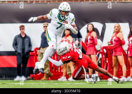 Baylor running back Bryson Washington, right, avoids a tackle by Utah ...
