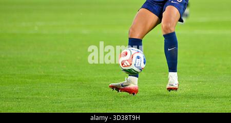 Players legs and Adidas Trionda, official match ball of the FIFA World ...