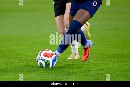 Players legs and Adidas Trionda, official match ball of the FIFA World ...