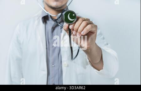 Nepal national healthcare. Doctor showing stethoscope with Nepal flag ...