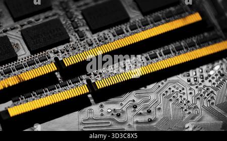 Macro Close up of computer RAM chip and motherboard on dark background ...