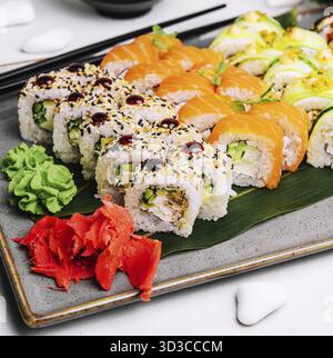 Different types of rice on plate on wooden background Stock Photo - Alamy
