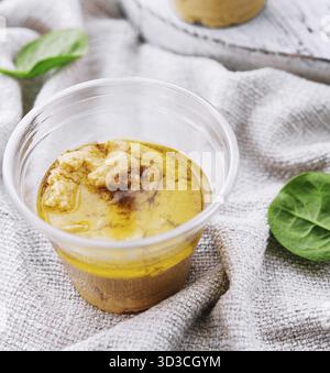 Food, Homemade hummus in a plastic cups with basil Stock Photo - Alamy