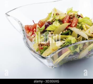 Plate with tasty grapefruit salad on color background, closeup Stock ...