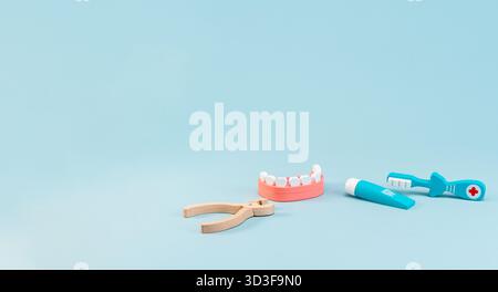 Dentist's tool kit on blue background Stock Photo - Alamy