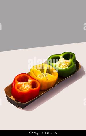 Fresh green bell peppers arranged on white textured background. Soft ...