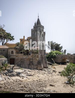 An old stone bridge with arches over the Abava river on a snowy winter ...