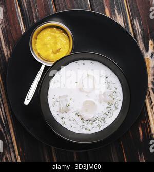 Okroshka, Russian cold soup on a wooden background Stock Photo - Alamy