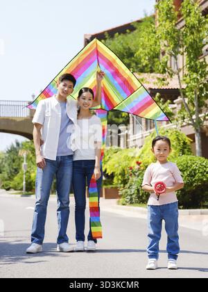 Happy family of three flying kites outdoors high quality photo Stock ...