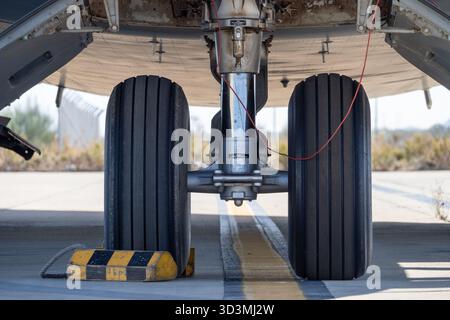 Aircraft nose landing gear on runway centerline Stock Photo - Alamy