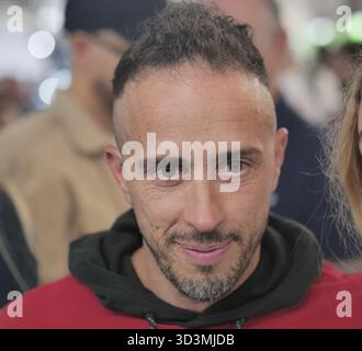 The Eicma Girls, a parade of models riding high-quality motorcycles at ...